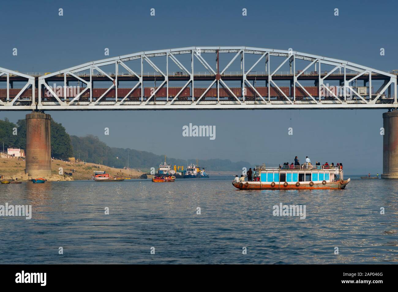 Train crossing the Ganges river on a bridge, Varanasi, Uttar Pradesh ...