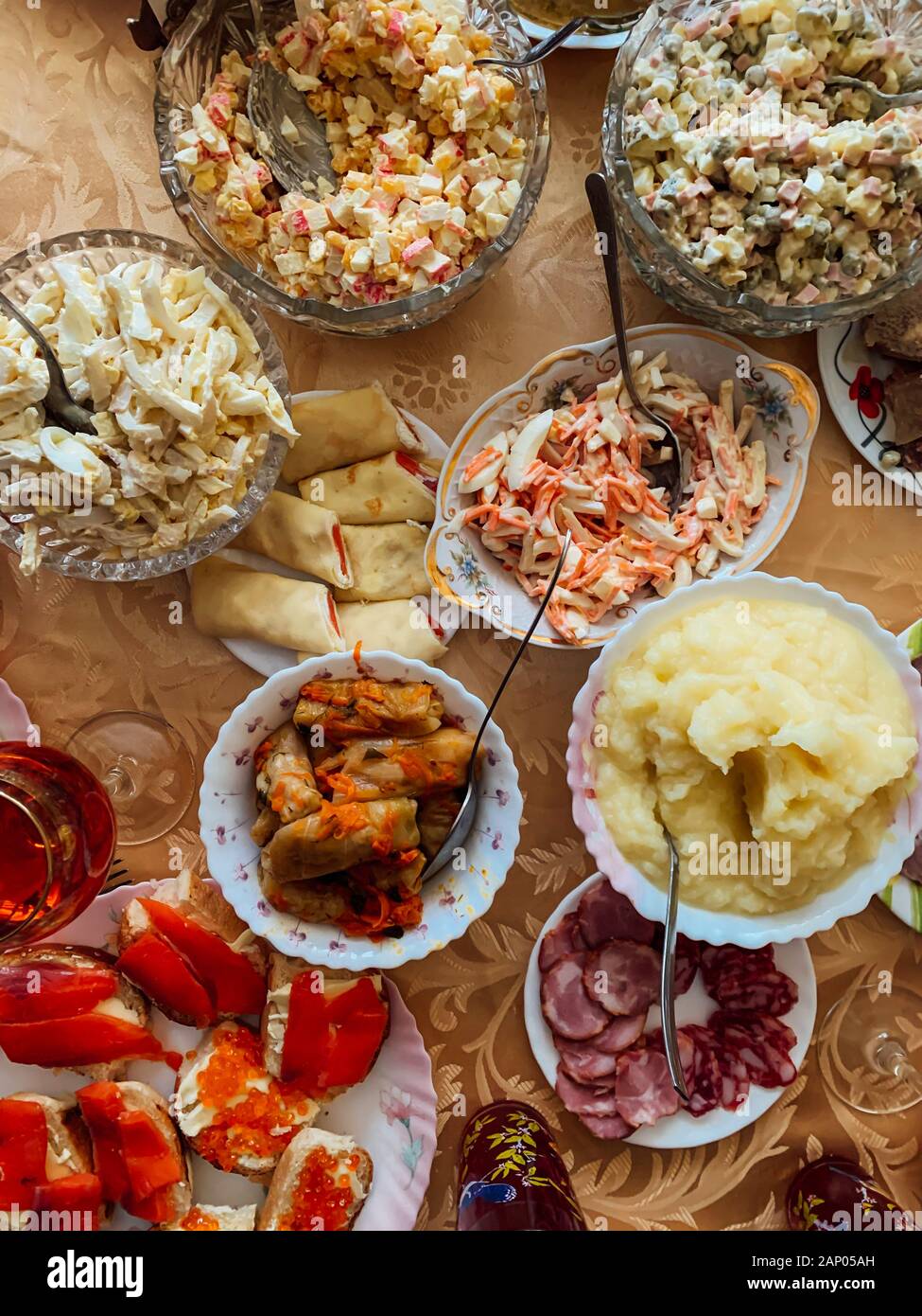 table with plates with delicious dinner background meal Stock Photo - Alamy