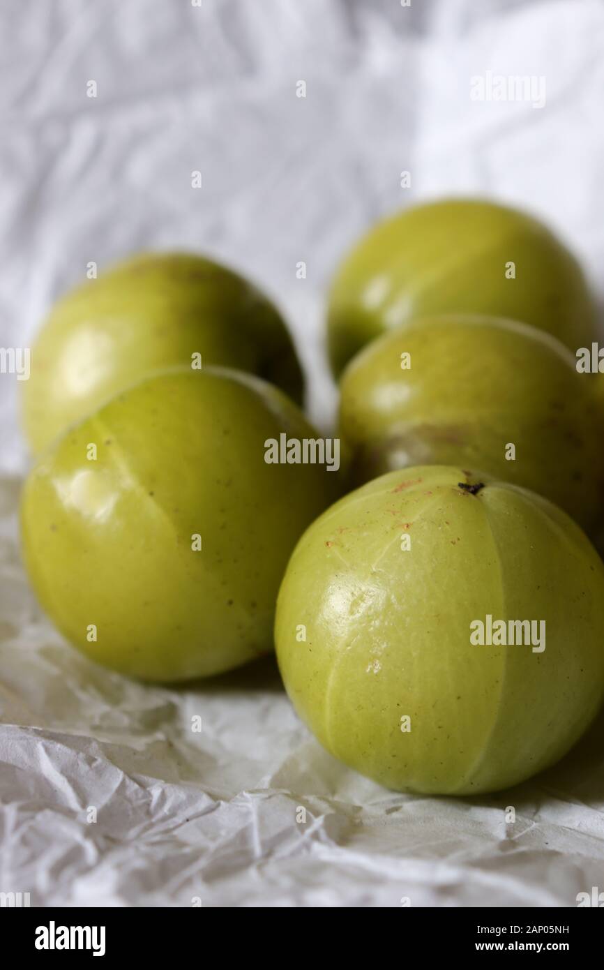 Fresh Indian gooseberry/amla against white background Stock Photo - Alamy