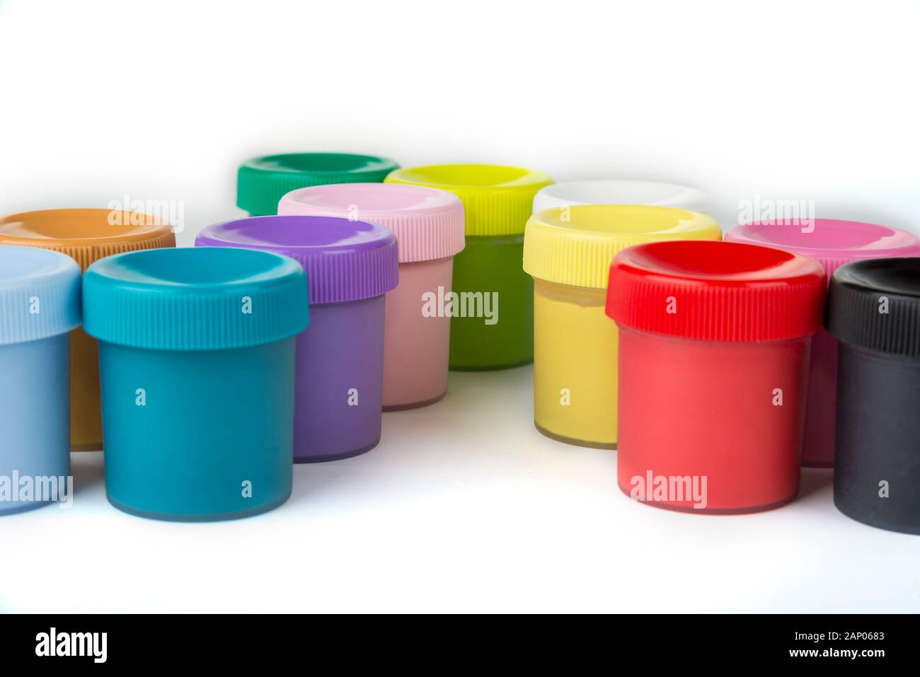 School paint in the plastic containers on a white background Stock ...