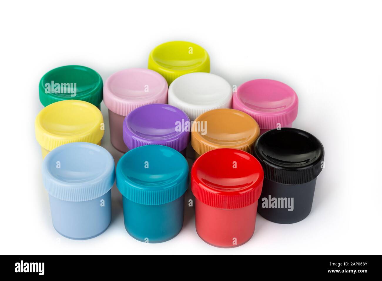 School paint in the plastic containers on a white background Stock ...