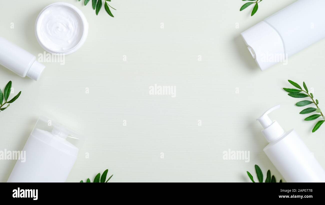 Frame of natural cosmetic products and green leaves. Top view hand ...