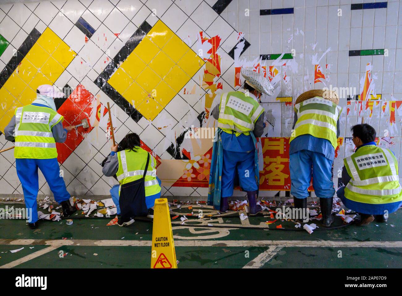 Removing posters hi-res stock photography and images - Alamy
