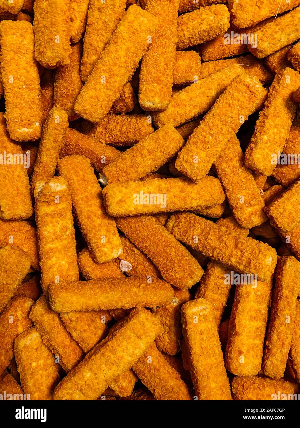 lots of fish sticks for frying food background Stock Photo - Alamy