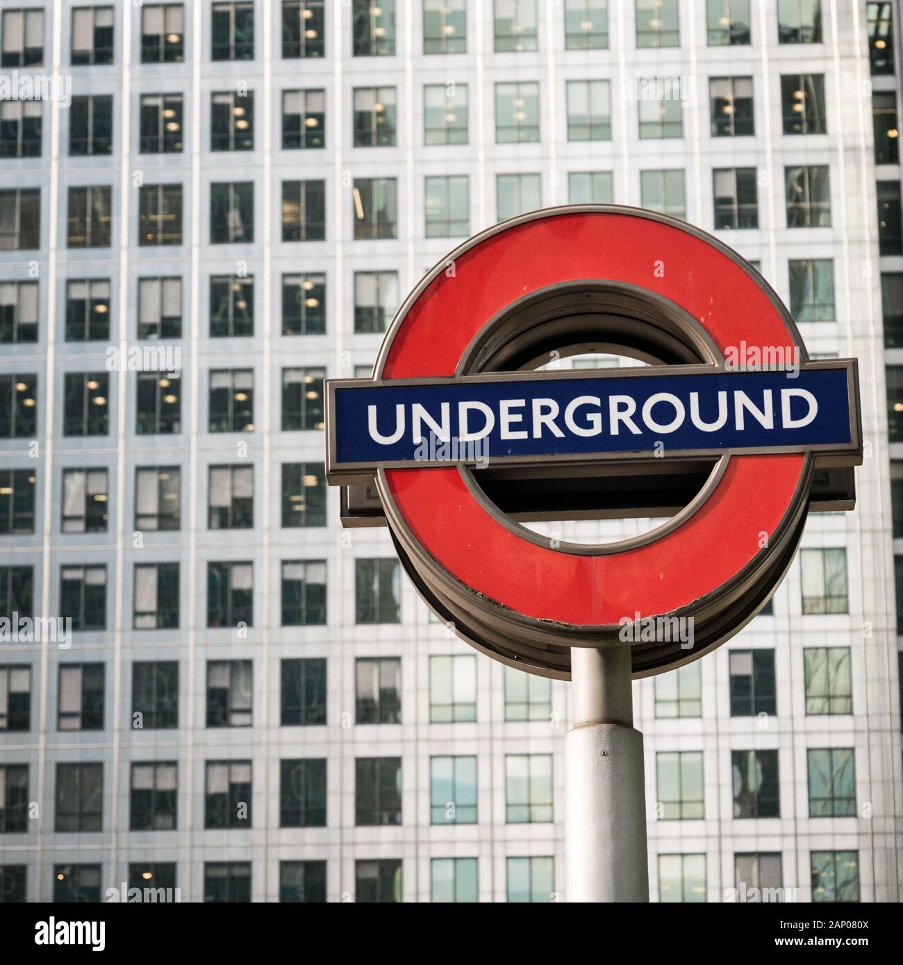 London Underground tube sign (Roundel) with the Docklands skyscraper ...