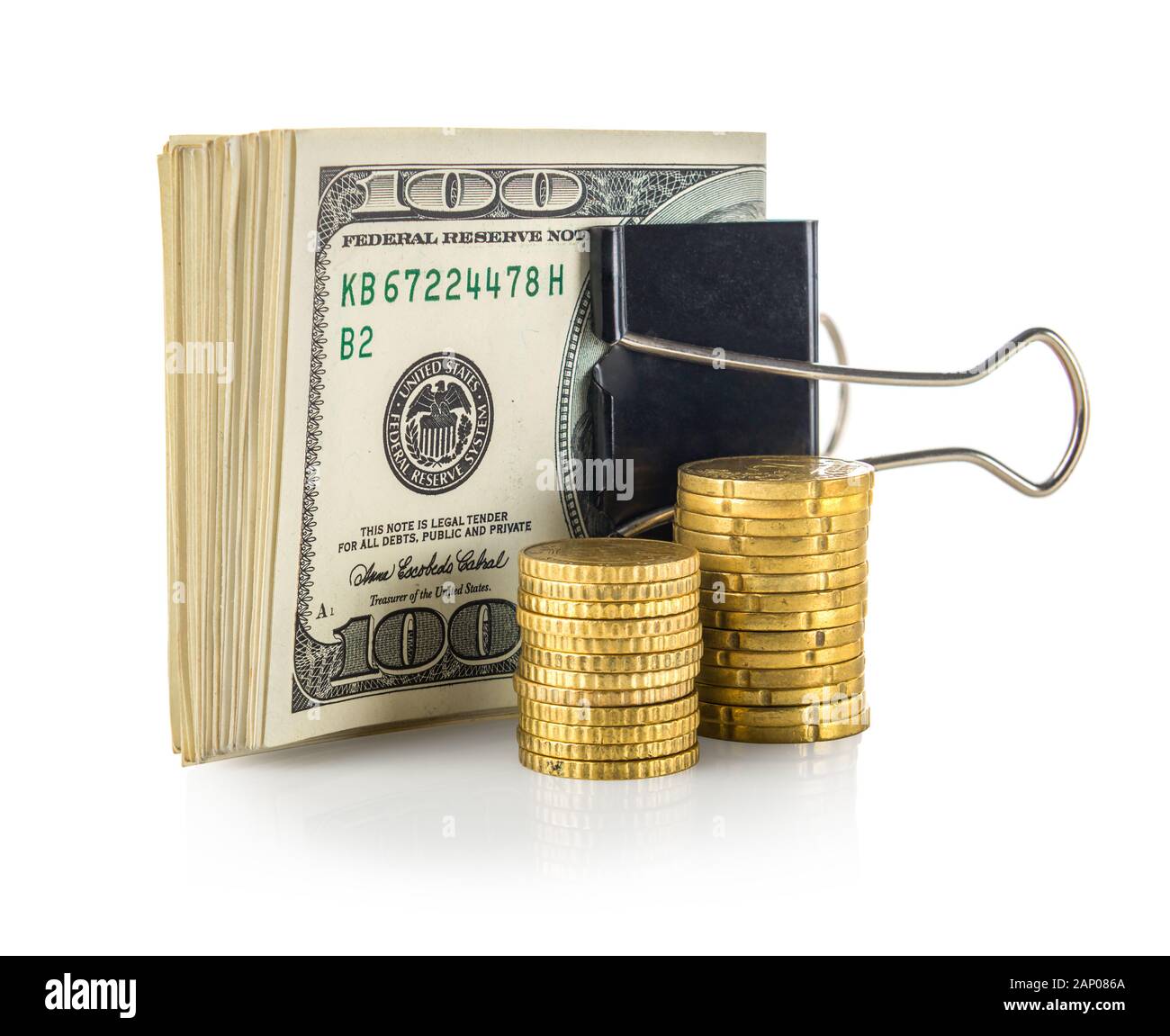 Dollars and coins isolated on a white background Stock Photo - Alamy