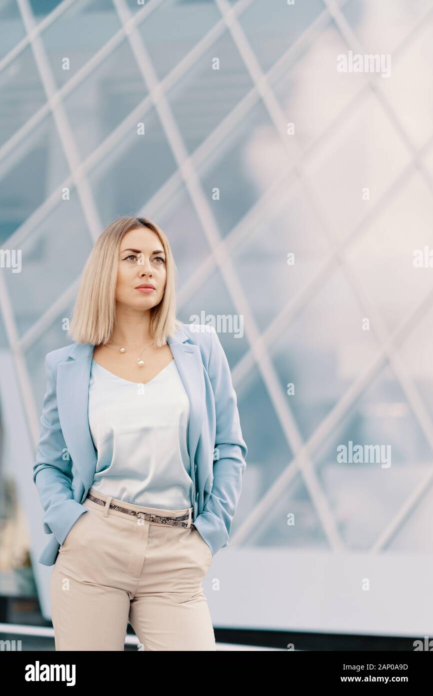 Successful business woman in blue suit. Beautiful young female ...