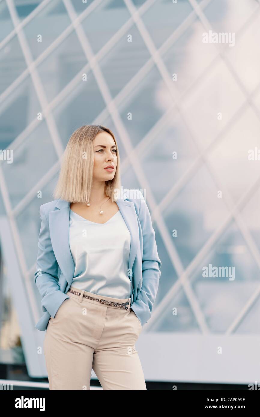 Successful business woman in blue suit. Beautiful young female ...
