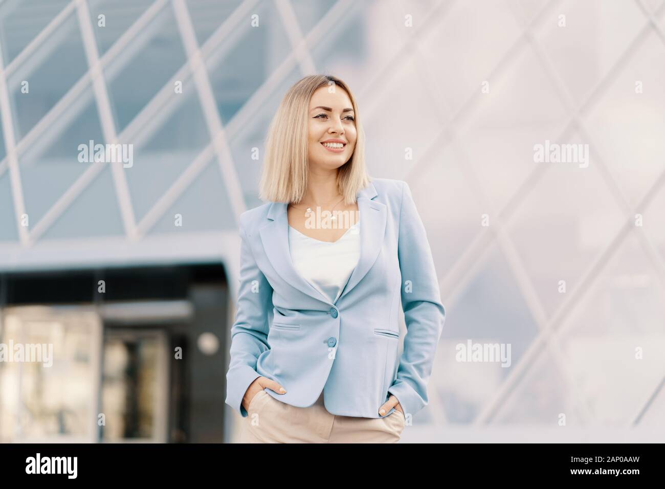 Successful business woman in blue suit. Beautiful young female ...