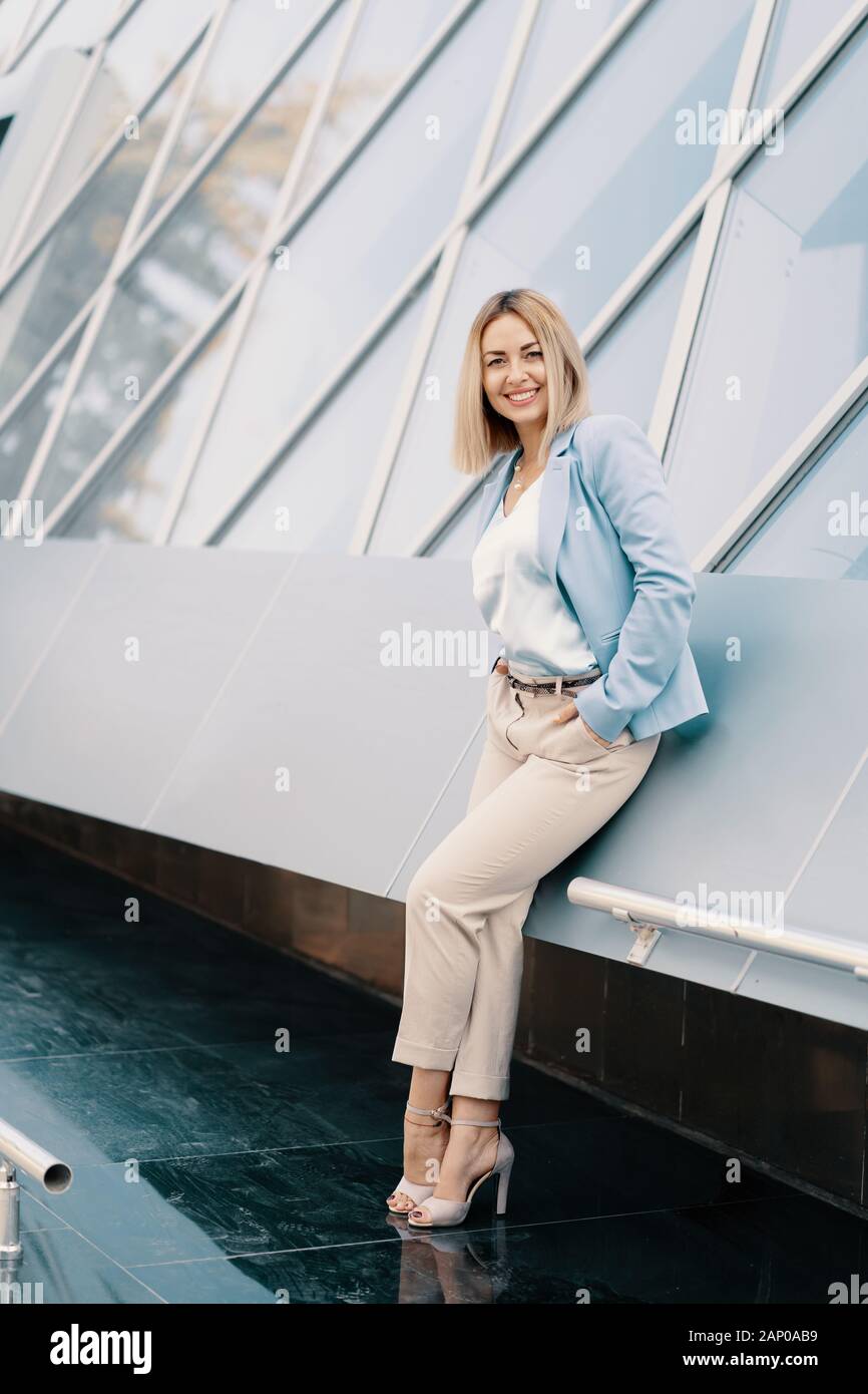 Successful business woman in blue suit. Beautiful young female ...