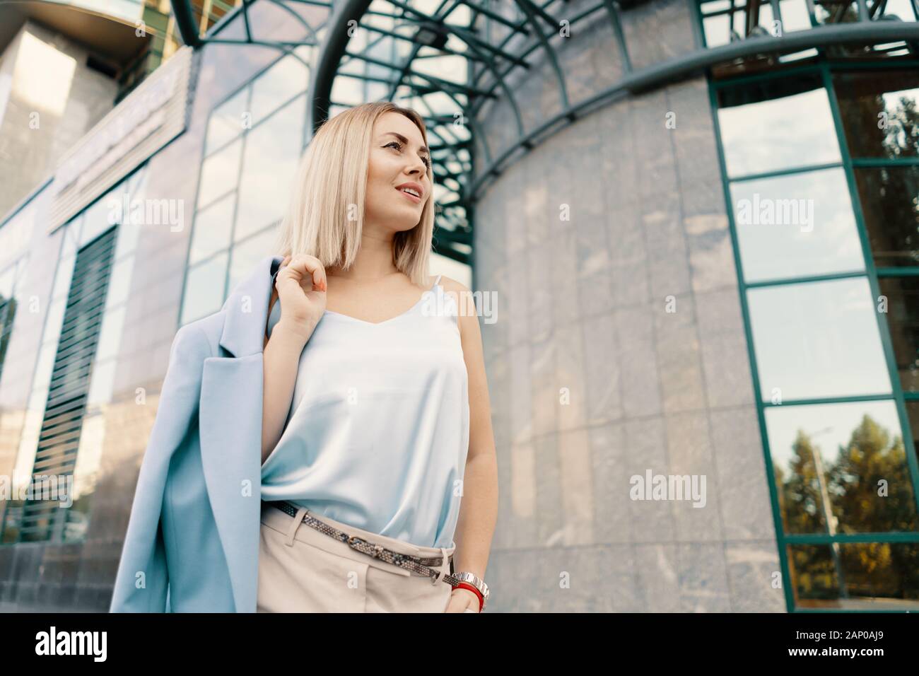Successful business woman in blue suit. Beautiful young female ...