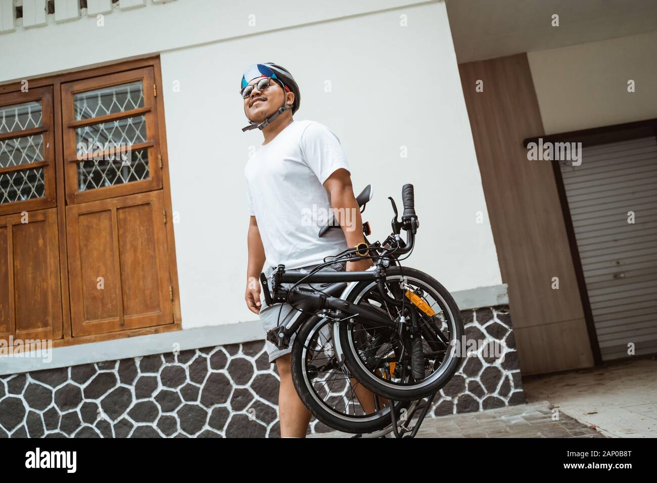 Man walking with bike walking biker push bike hi-res stock photography ...