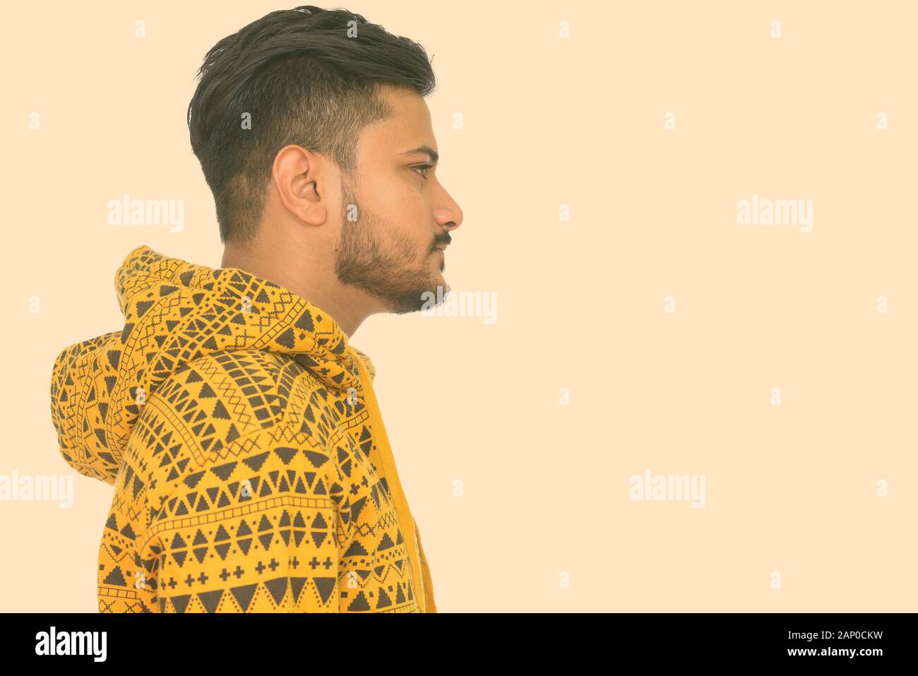 Side view of young handsome Indian man Stock Photo - Alamy