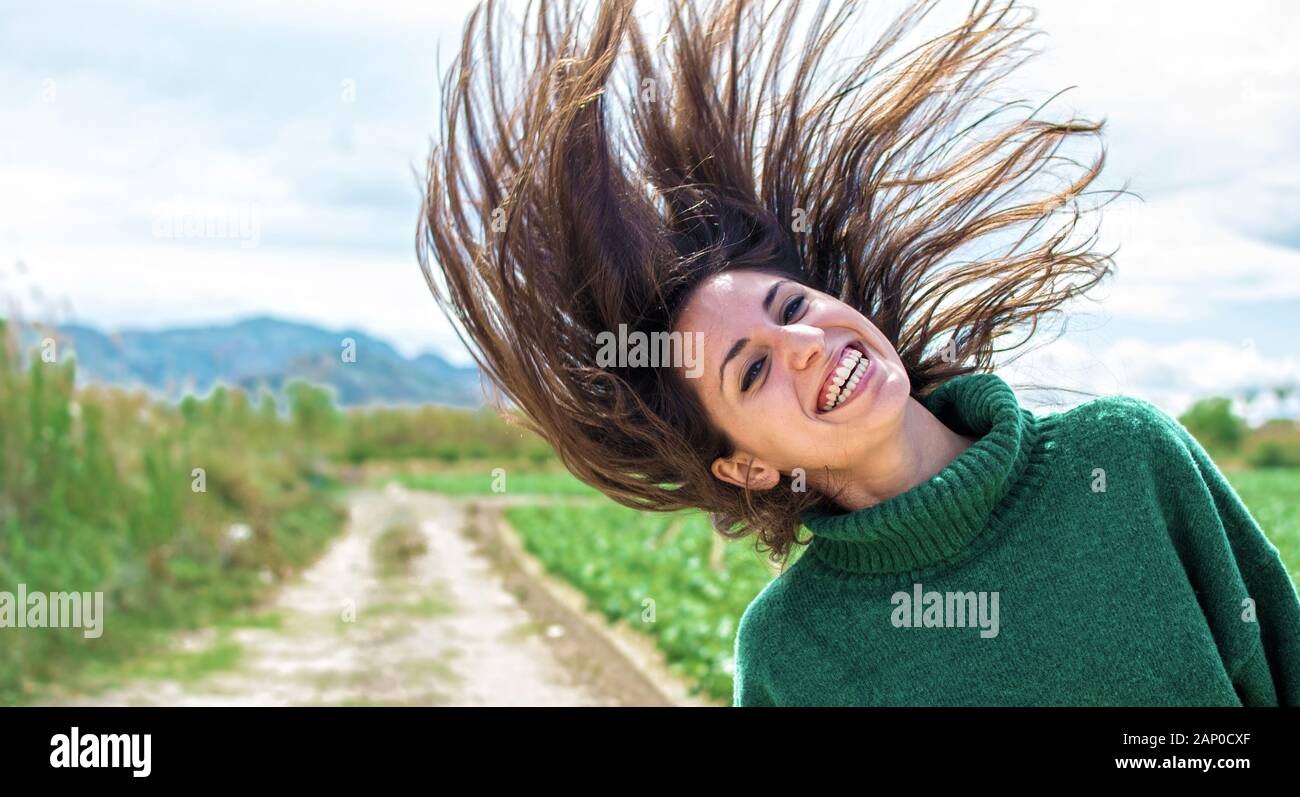 Portrait of laughing beautiful woman smiling in nature Stock Photo - Alamy