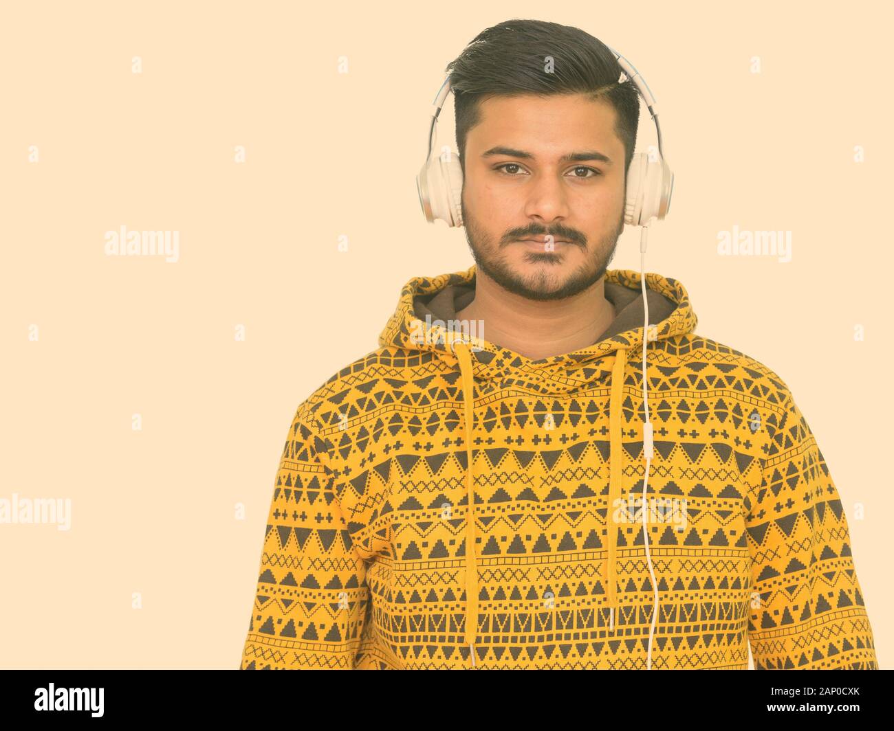 Young handsome Indian man listening to music Stock Photo - Alamy