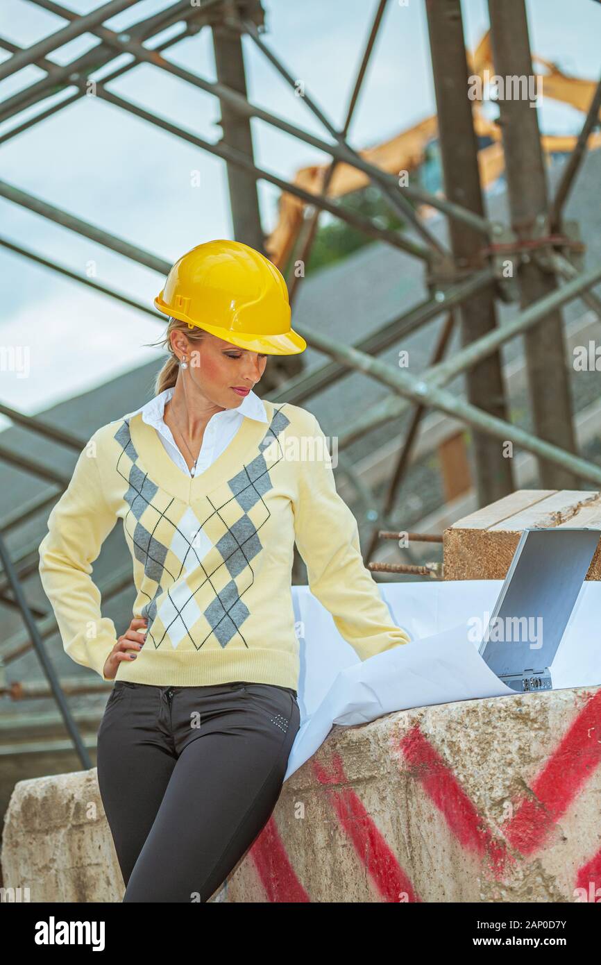 A young female constructor at building of a new motorway in Germany ...