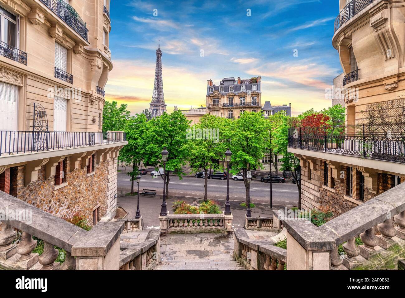 Small Paris street in spring with view on the famous Eiffel Tower in ...