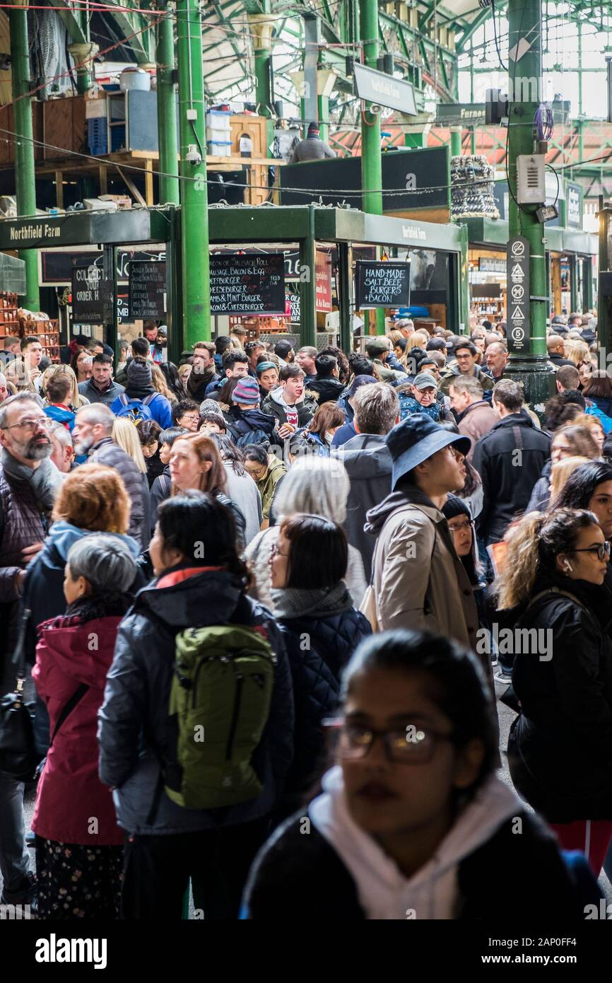 Crowds of tourists in a busy Borough Market in London Stock Photo - Alamy