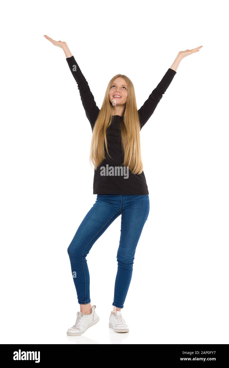 Girl holding arms above head hi-res stock photography and images - Alamy