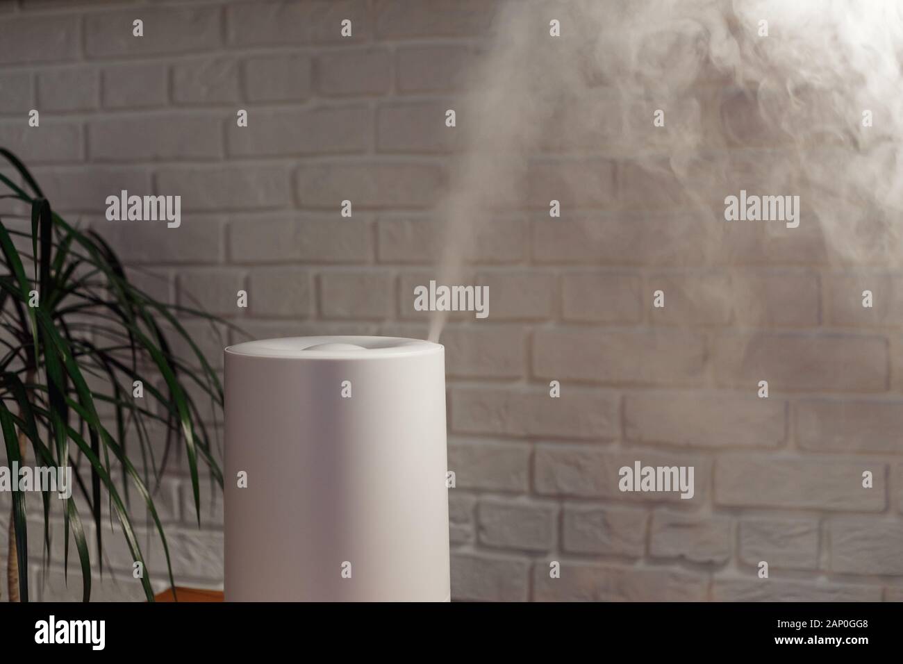 Domestic humidifier spreading steam into the living room Stock Photo ...