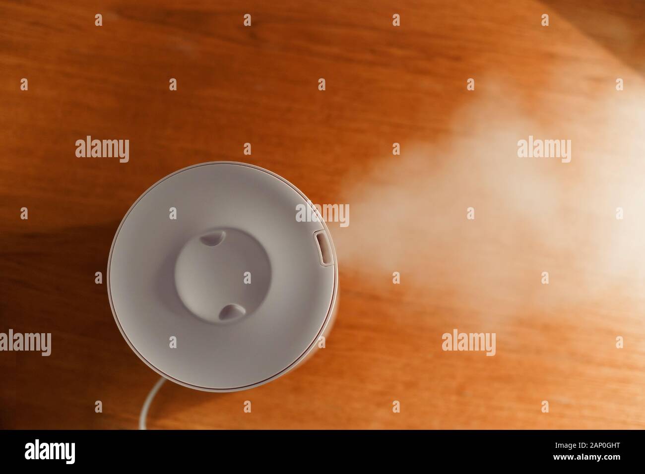 Humidifier spreading steam into the living room Stock Photo - Alamy