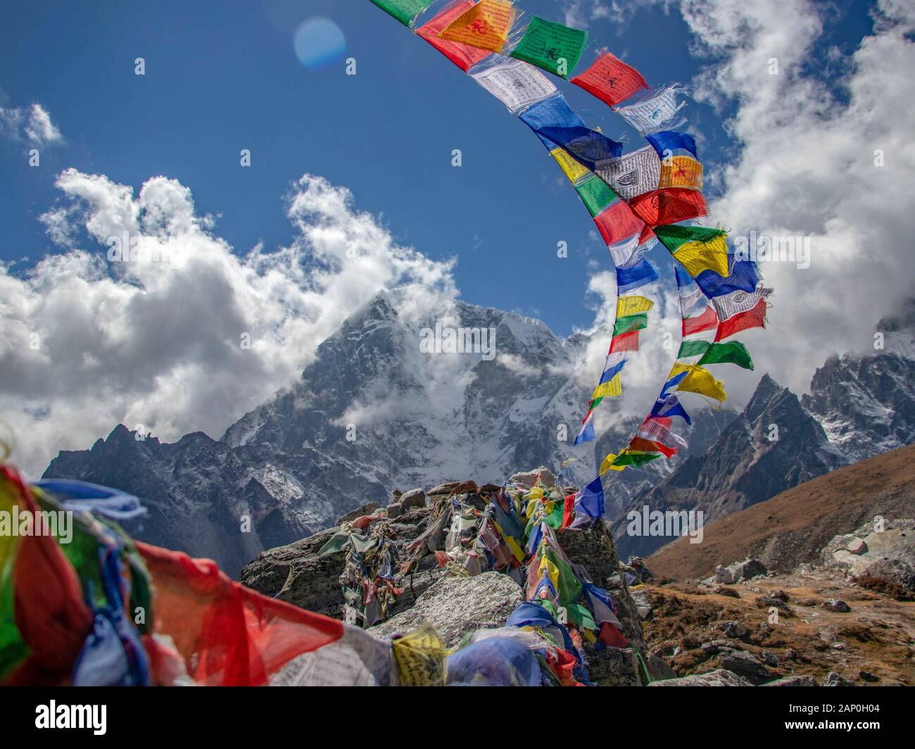 Prayer flags dazzling in the wind in the Himalaya mountains in Nepal ...