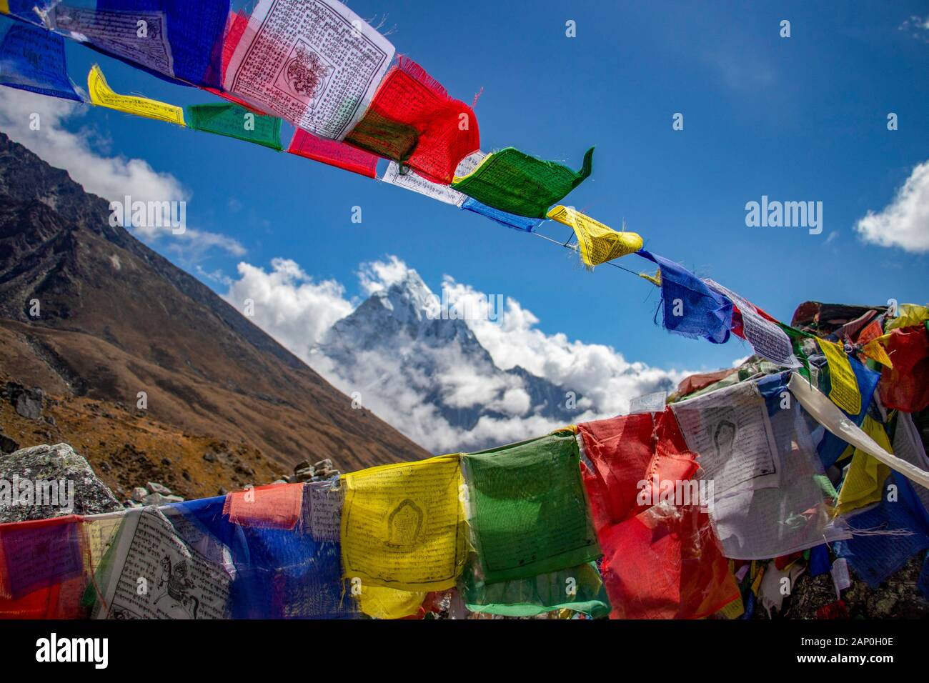 Prayer flags dazzling in the wind in the Himalaya mountains in Nepal ...