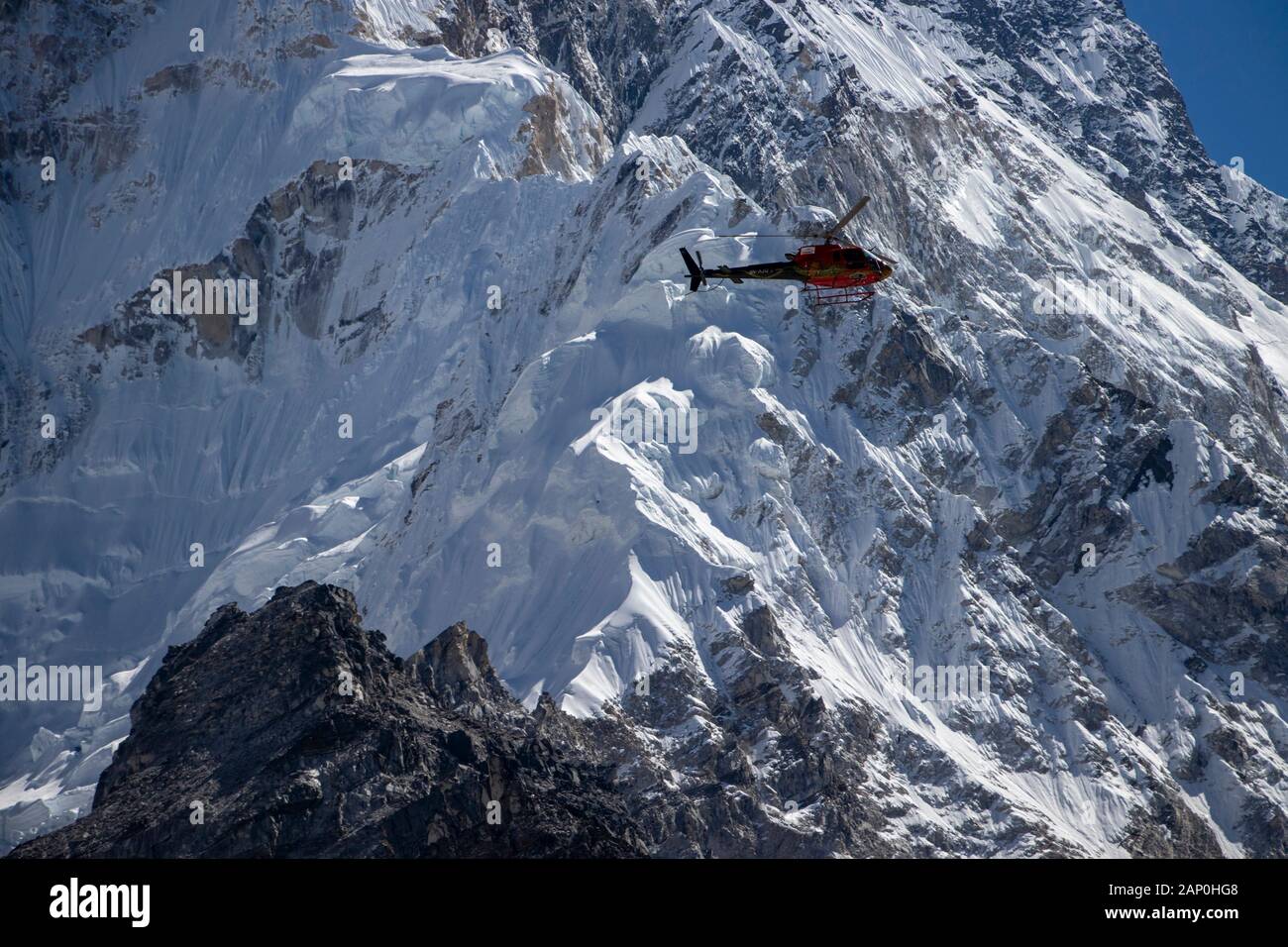 Helicopter rescue in the Himalayan Mountains in Nepal Stock Photo - Alamy