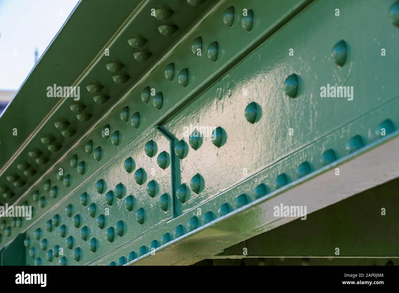 Metal parts of the rivet joints and bolts of the bridge construction ...