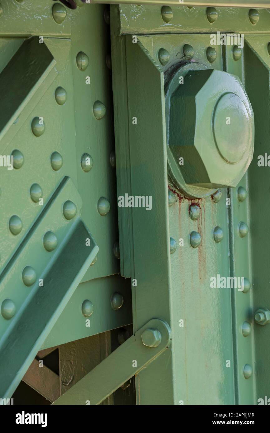 Metal parts of the rivet joints and bolts of the bridge construction ...