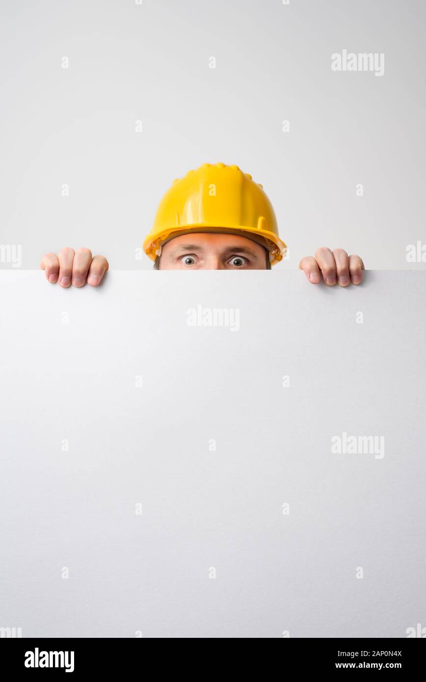 Worker holding blank board on white background Stock Photo - Alamy