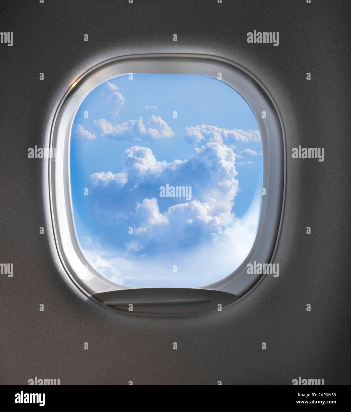 Aerial view of cloudy sky through airplaine window Stock Photo - Alamy