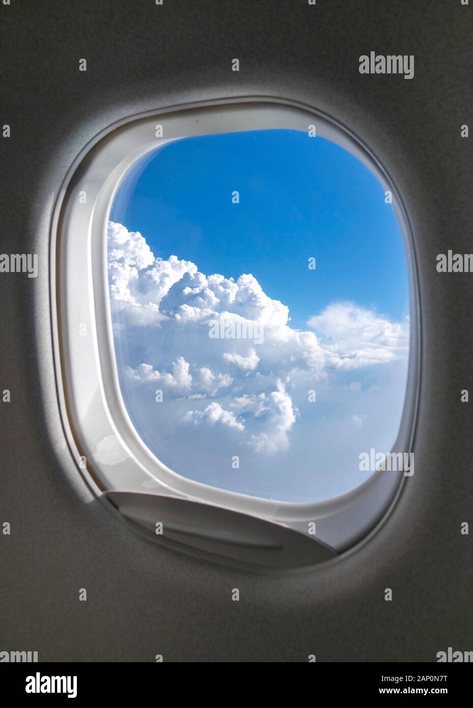 Airplane window with picture of sky cloudy aerial view Stock Photo - Alamy