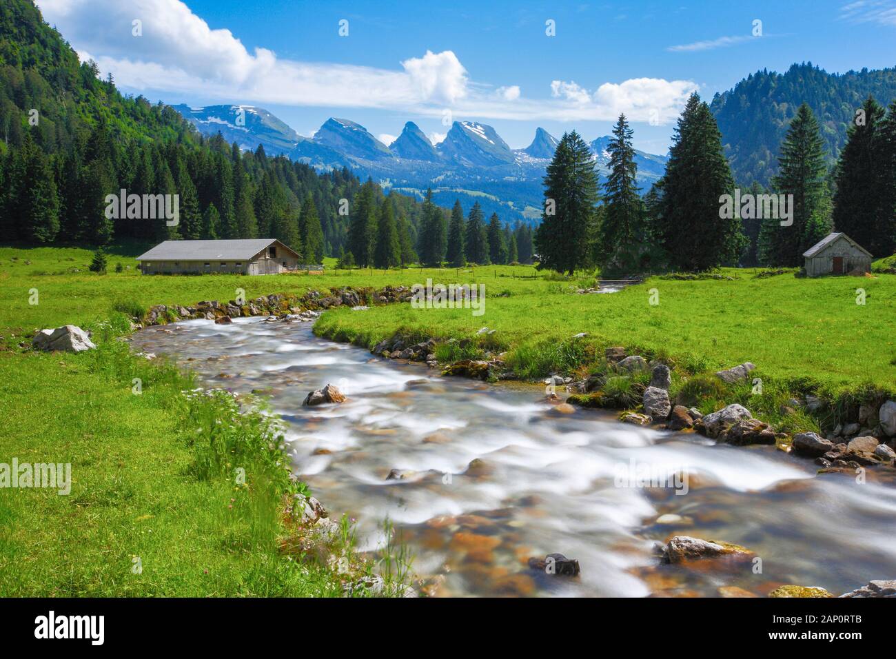 The river Thur flows through the valley Toggenburg. In the background ...