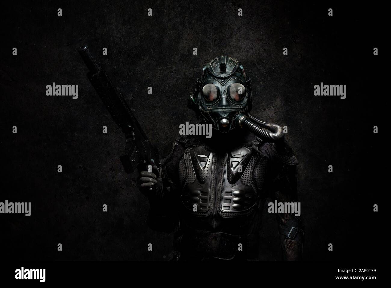 Futuristic warrior a machine gun in his hands Stock Photo - Alamy