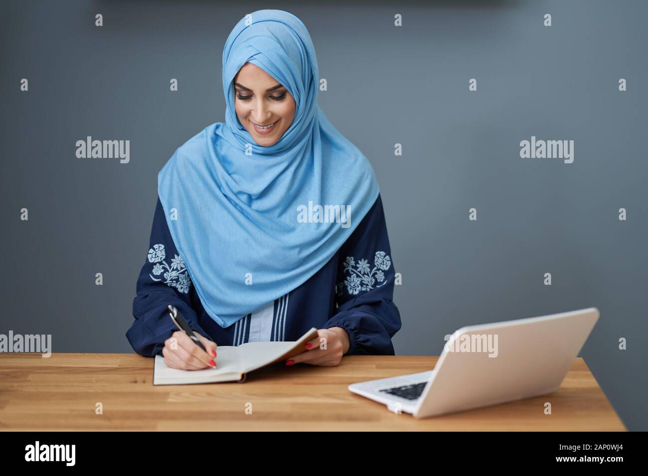 Muslim female student learning at home Stock Photo - Alamy