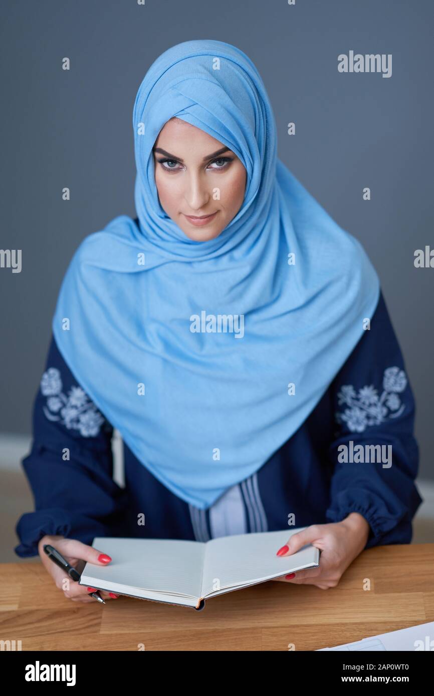 Muslim female student learning at home Stock Photo - Alamy