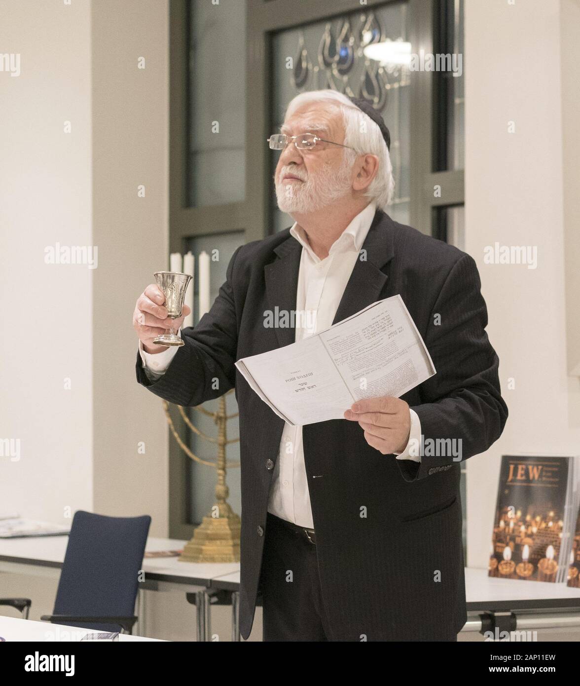 Cantor Jakow Zelewitsch giving the blessing for the Channuka Festival ...