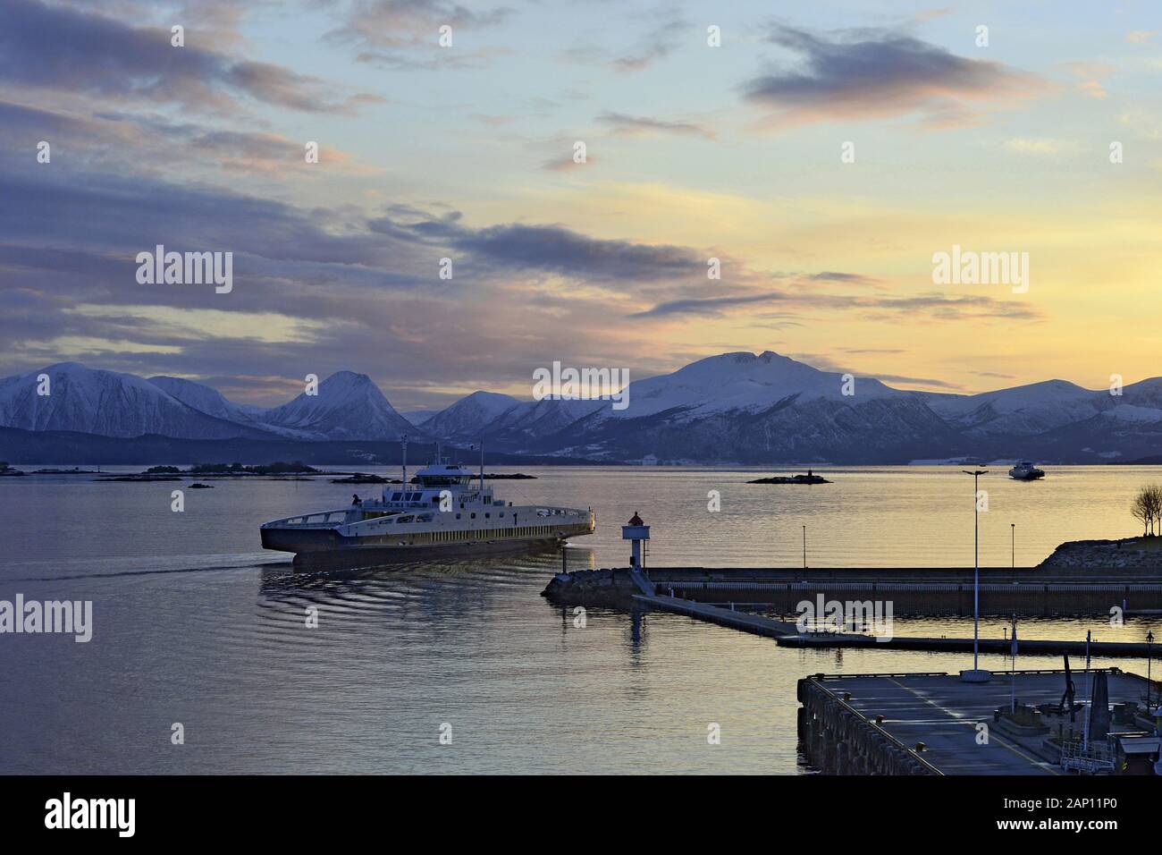 Molde's harbour with a passenger ferry and mountains on the horizon ...