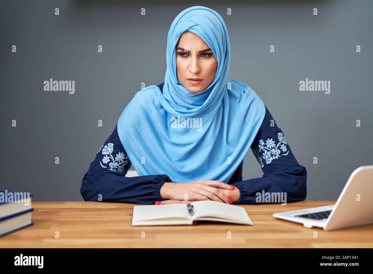 Muslim female student learning at home Stock Photo - Alamy
