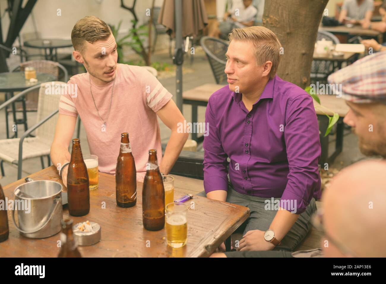 Portrait of men as group of friends hanging out and relaxing together ...