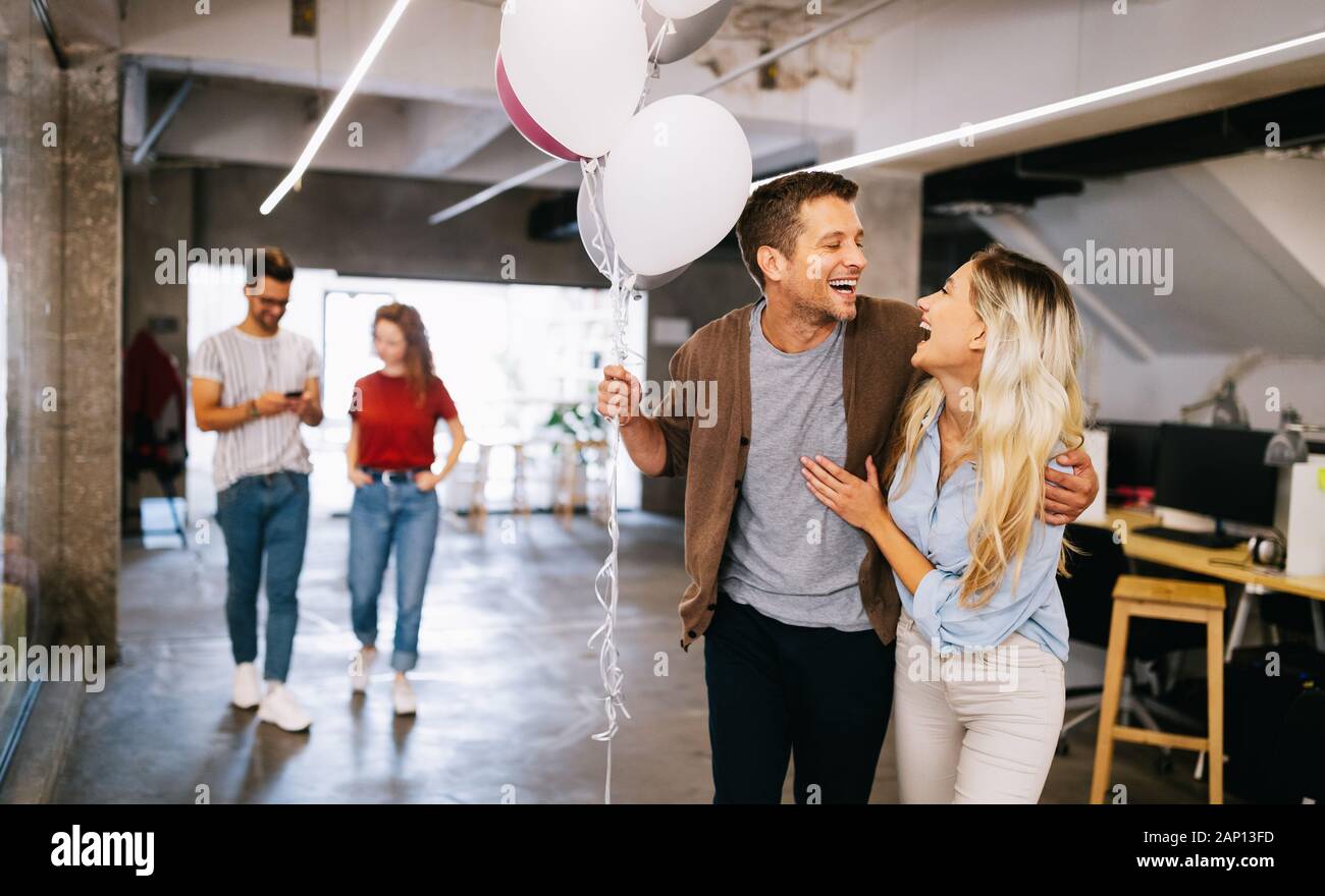 Colleagues celebrating a birthday in the office Stock Photo - Alamy