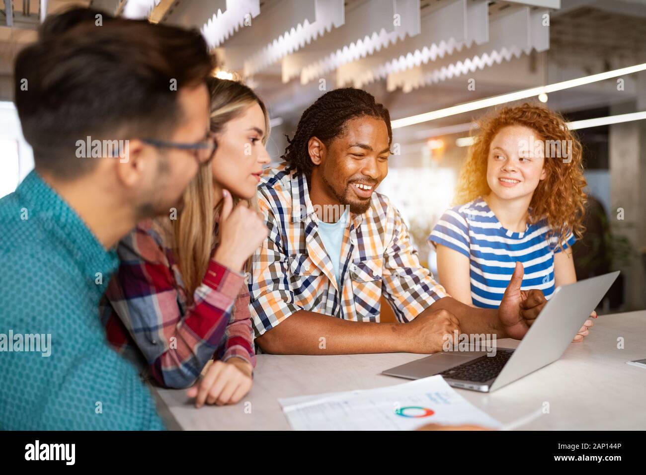 Happy creative team in office. Business, startup, design, people and ...