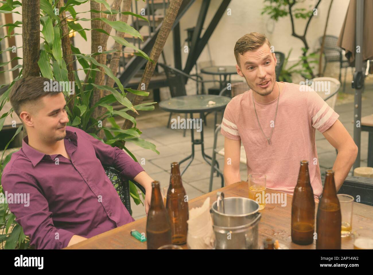 Portrait of men as group of friends hanging out and relaxing together ...