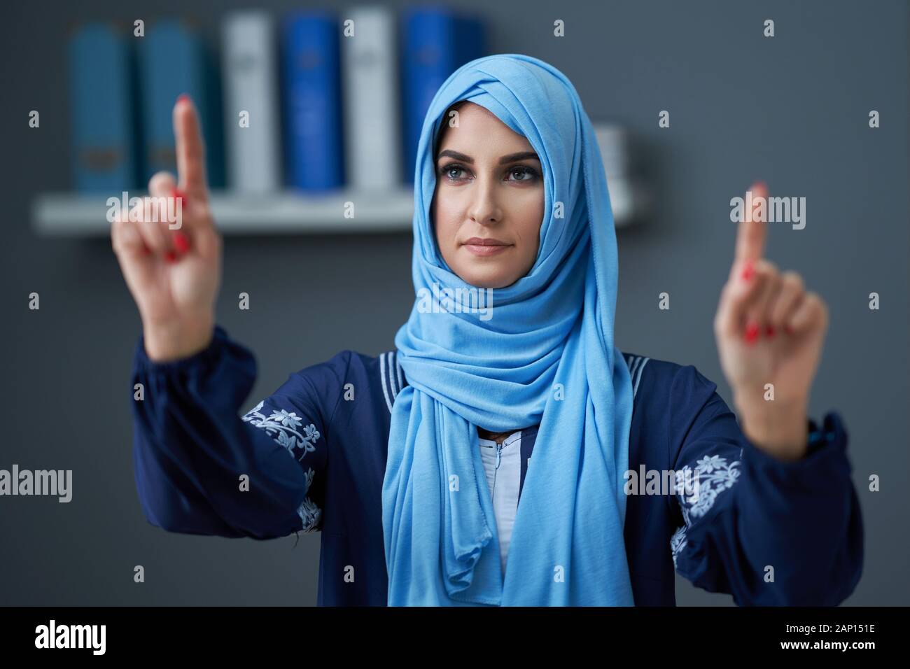 Muslim female student learning at home Stock Photo - Alamy