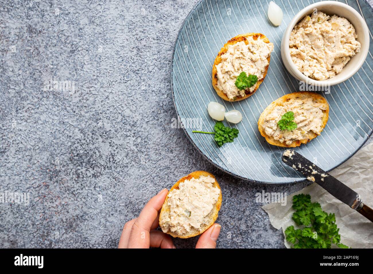 Sandwiches with salmon pate and baguette, fish bruschetta, top view ...