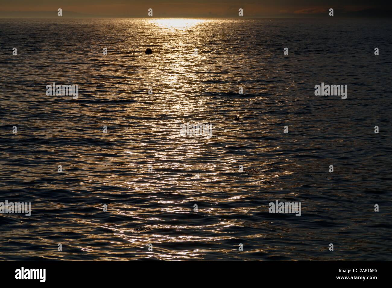 Sunlight reflecting onto the sea Stock Photo - Alamy
