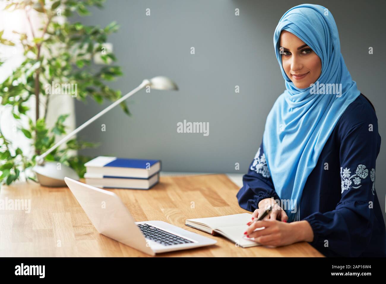 Muslim female student learning at home Stock Photo - Alamy