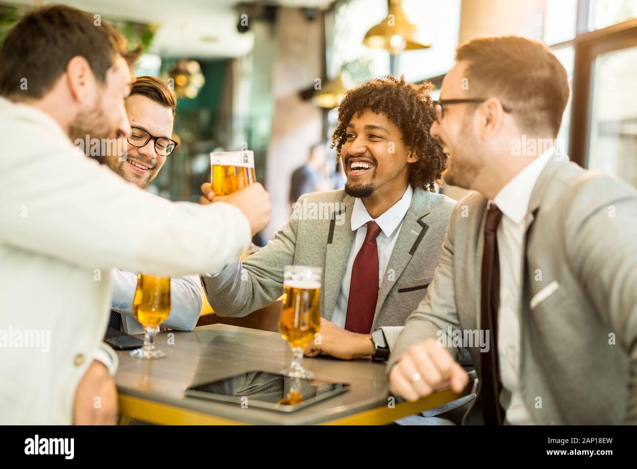 Fun after work with beer. Group businessman drink beer after work Stock ...