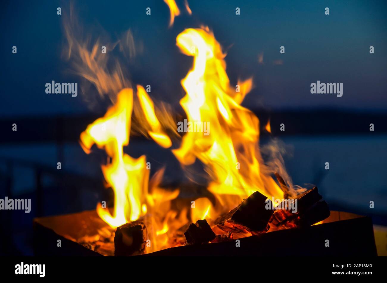 The firewood burning in a brazier closeup in the night Stock Photo - Alamy